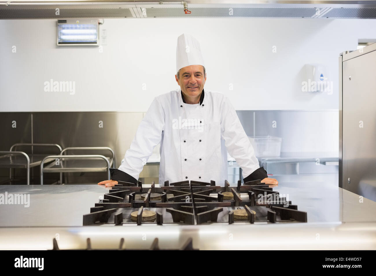 Chef standing at grill Stock Photo - Alamy