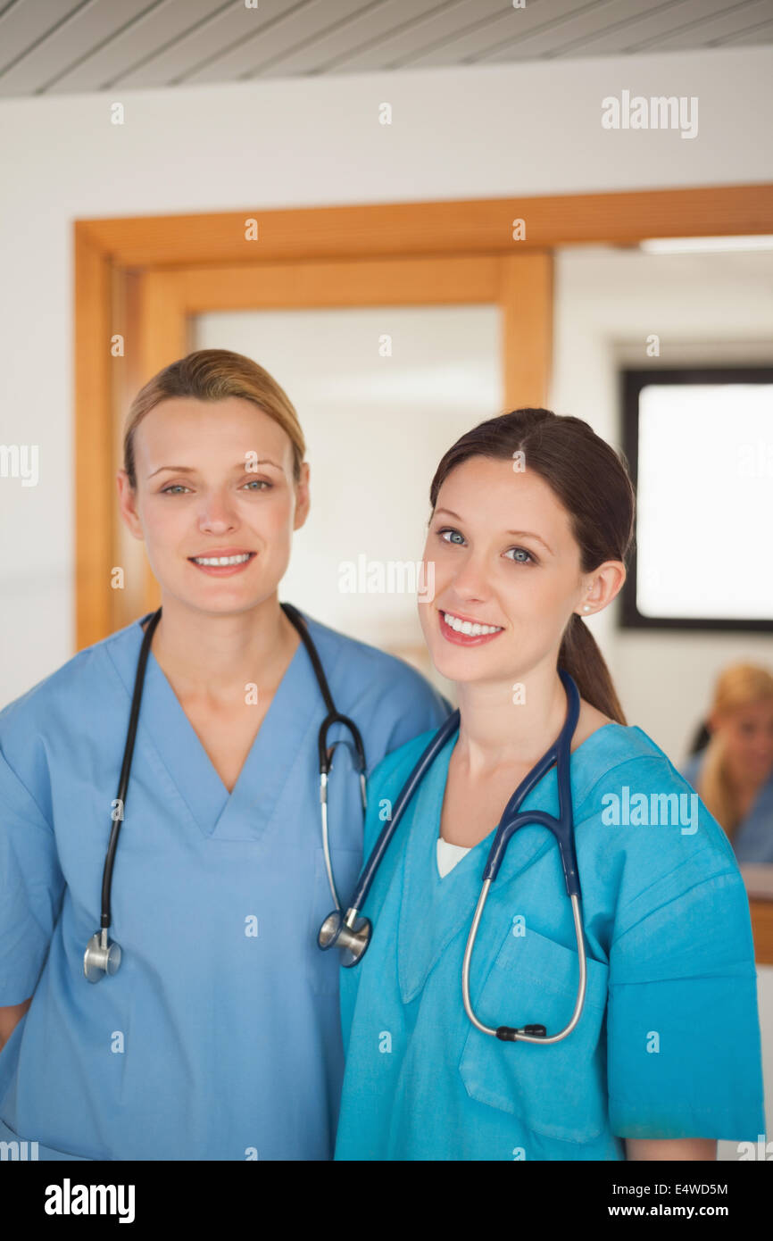 Female nurse and intern looking at camera Stock Photo - Alamy