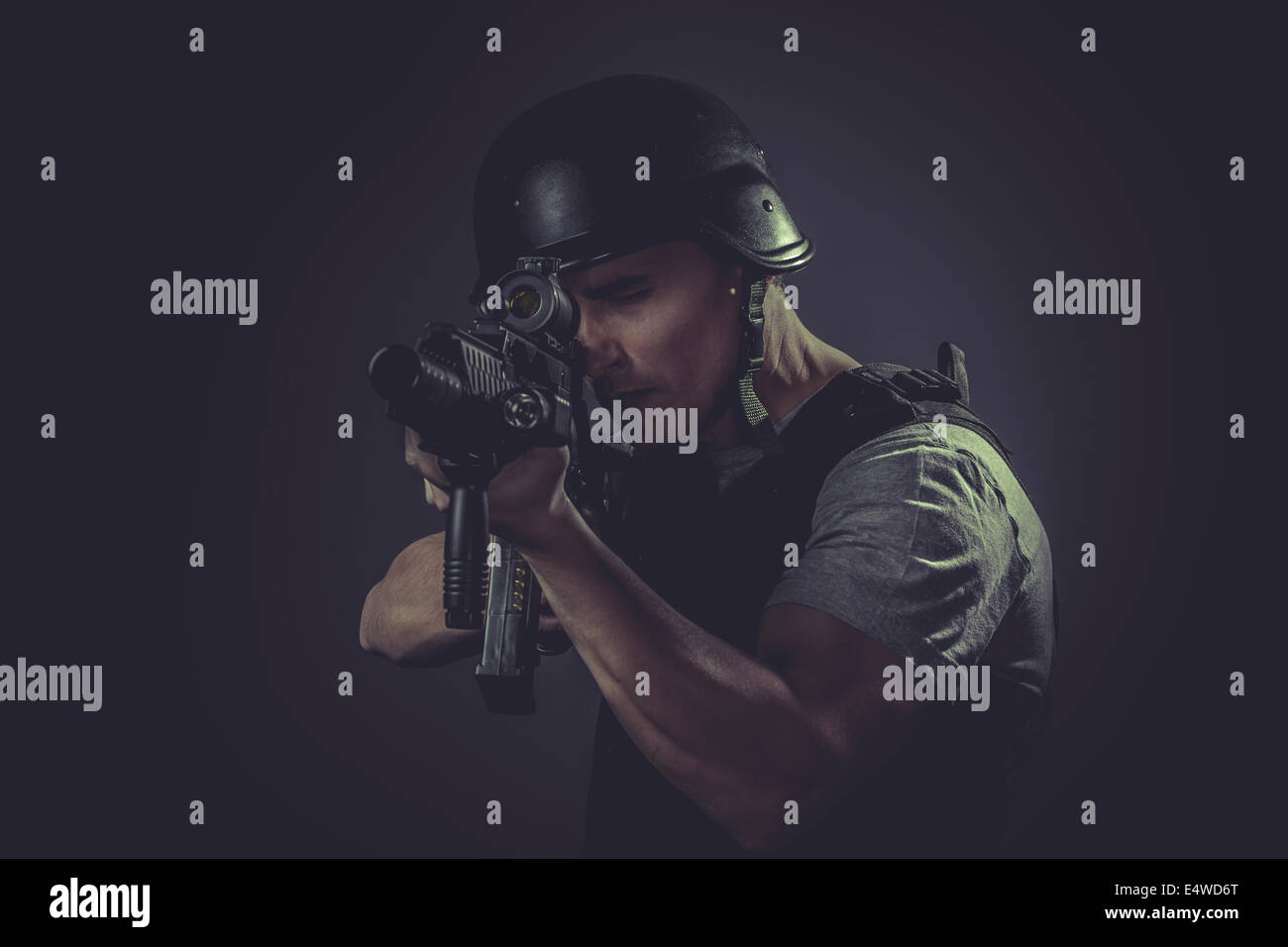 Security sport player wearing protective helmet aiming pistol ,black ...