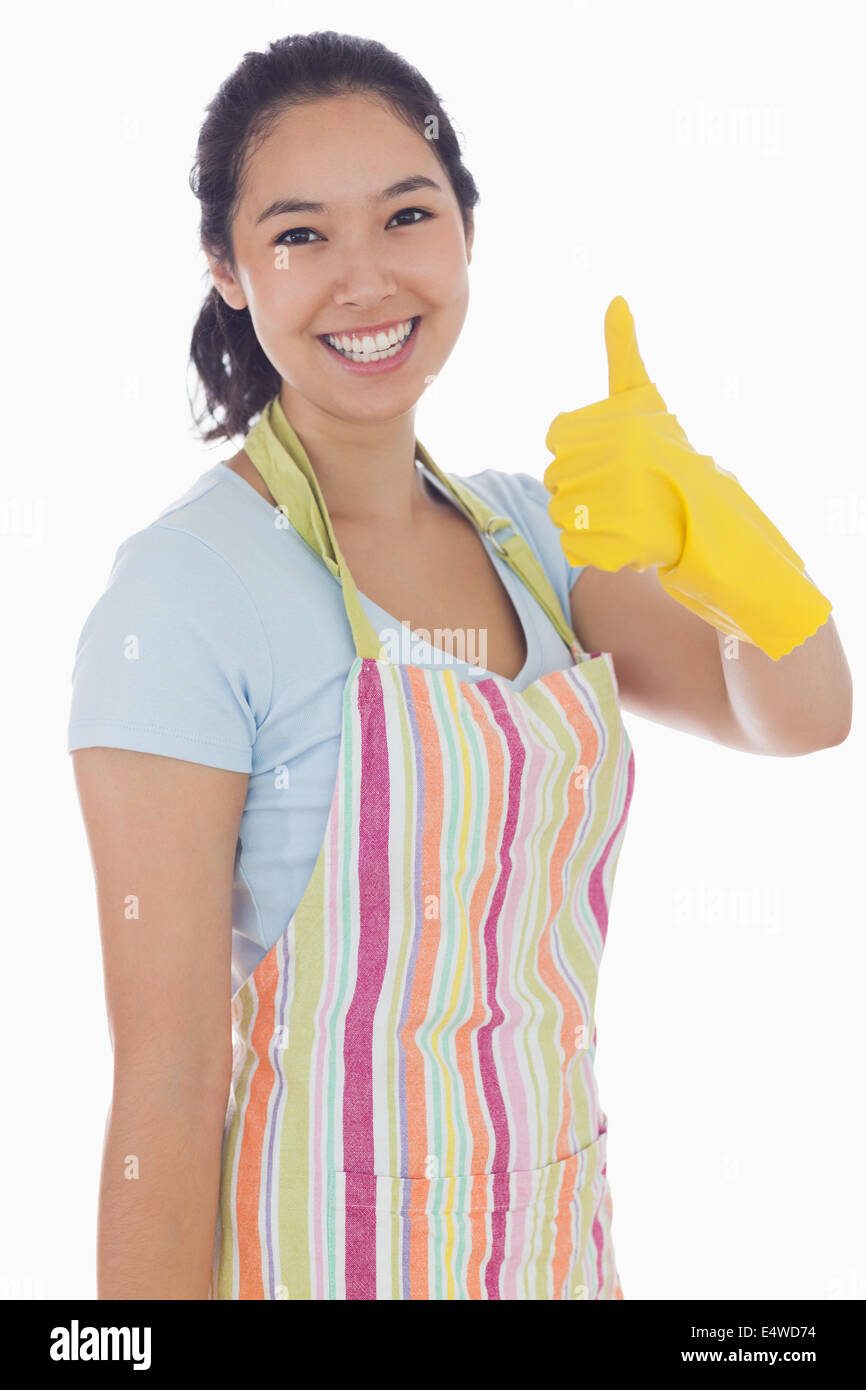 Woman in cleaning clothes giving thumbs up Stock Photo - Alamy