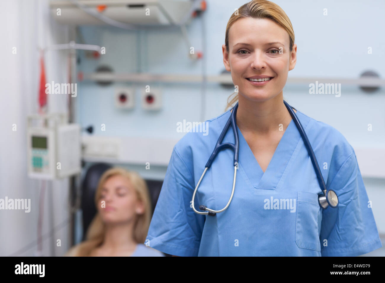 Nurse standing while looking at camera Stock Photo - Alamy