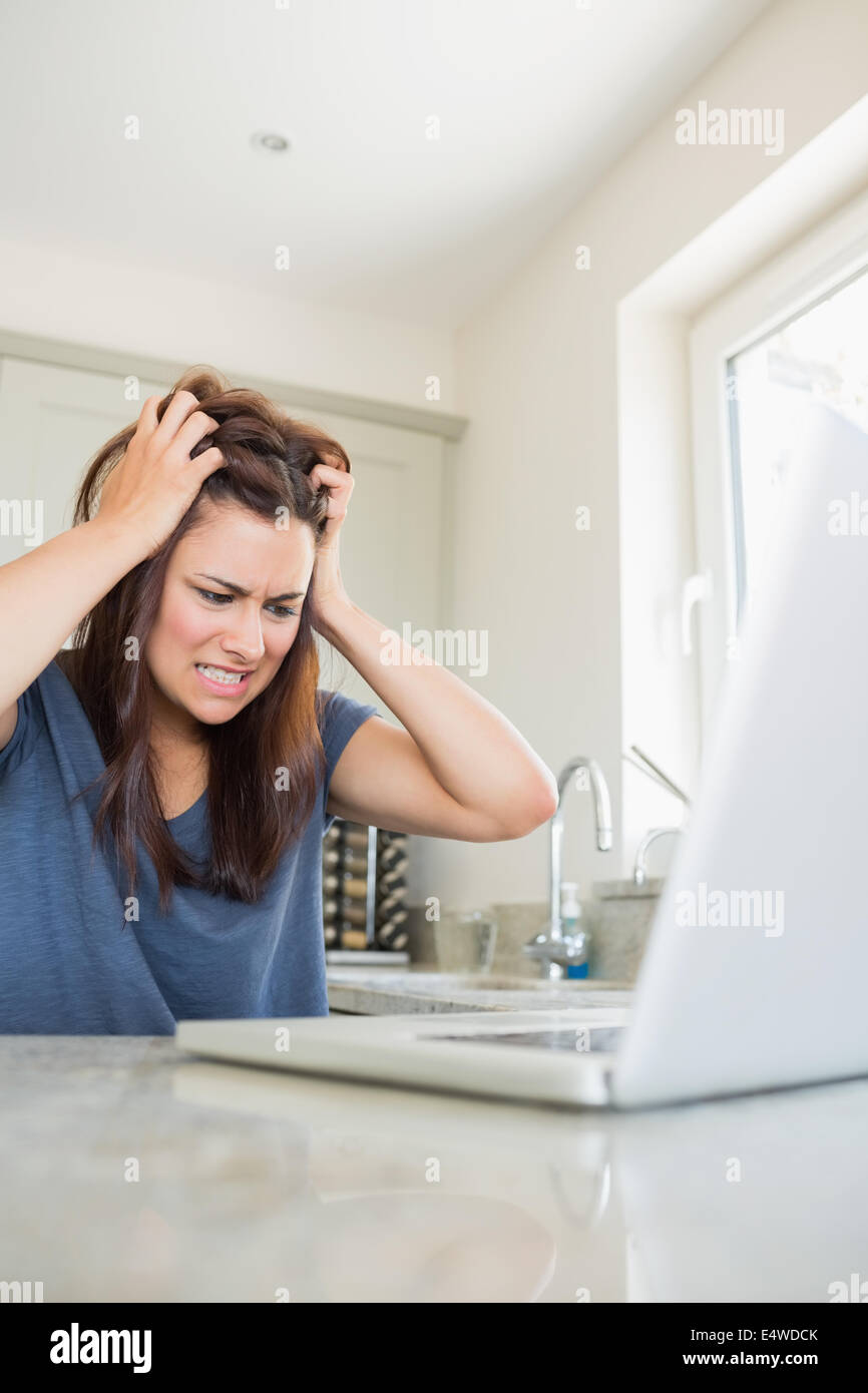 Angry woman with laptop Stock Photo - Alamy