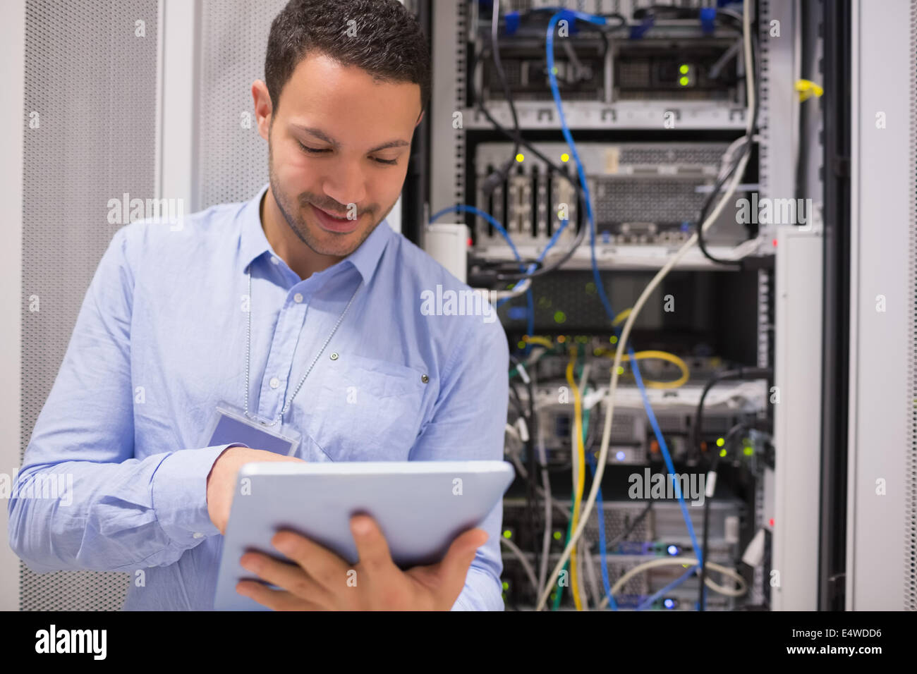 Data centre worker with tablet computer Stock Photo - Alamy