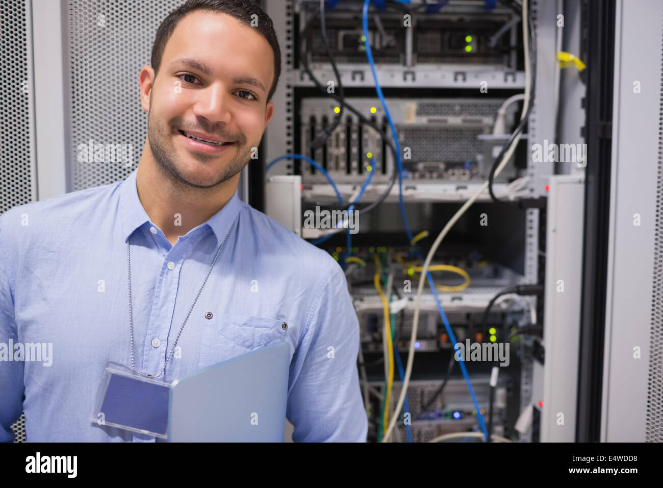 Man smiling in front of the servers Stock Photo - Alamy