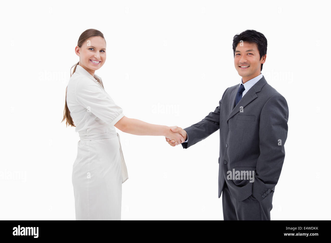 Two business people shaking hands Stock Photo - Alamy