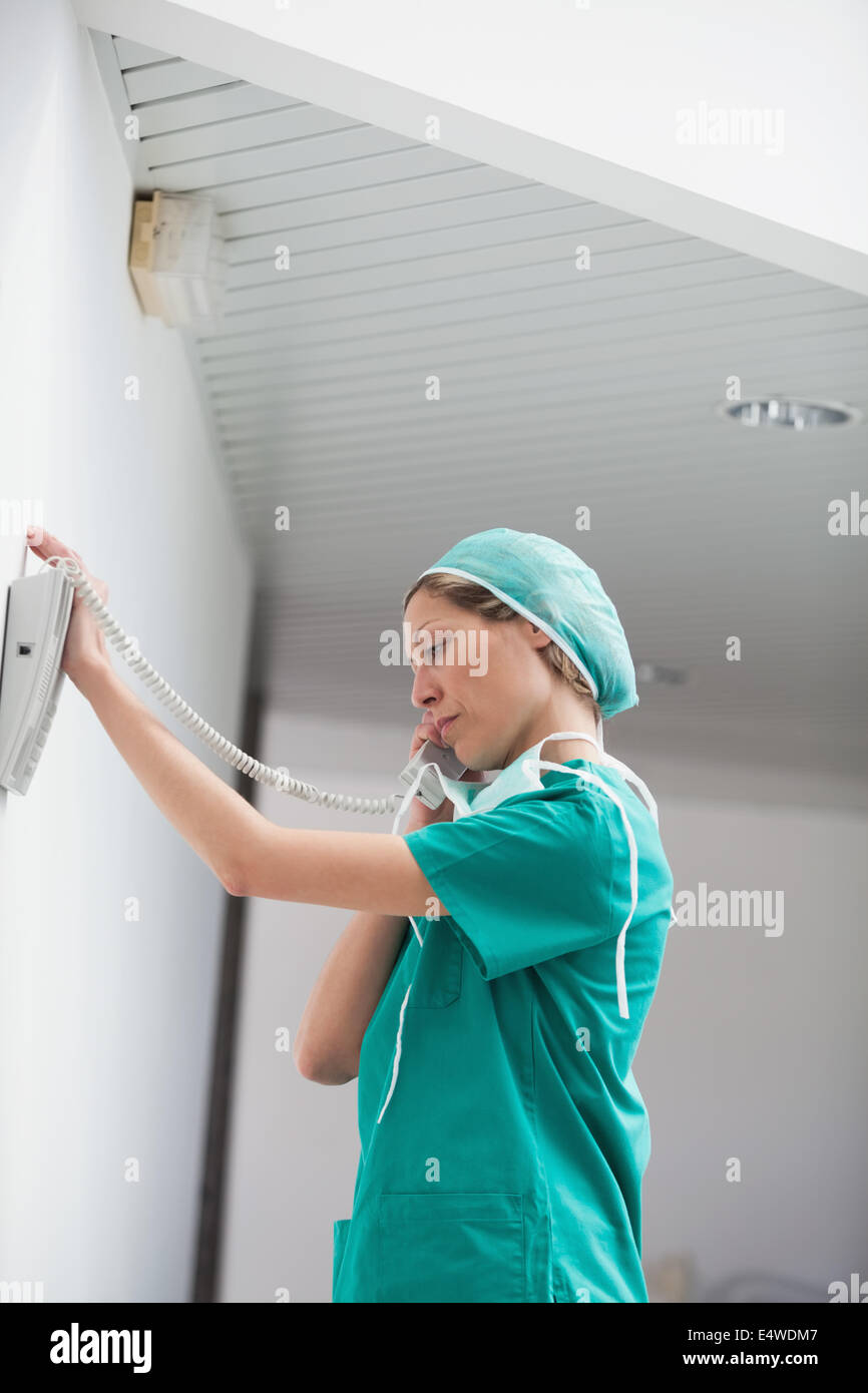 Female surgeon holding a phone Stock Photo - Alamy Female surgeon holding a phone Stock Photo - Alamy