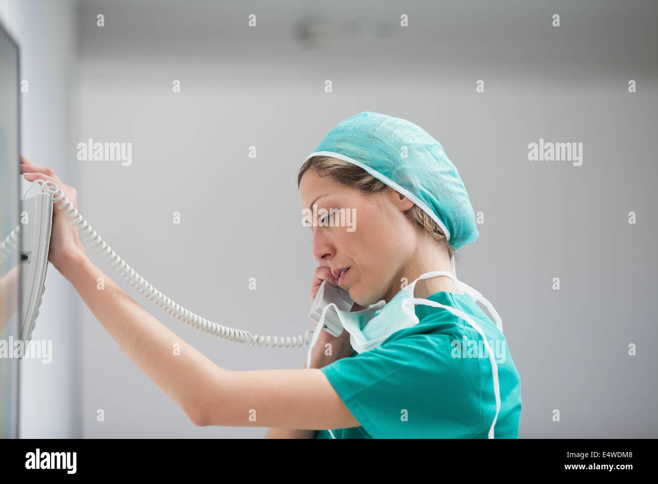Female surgeon calling Stock Photo - Alamy