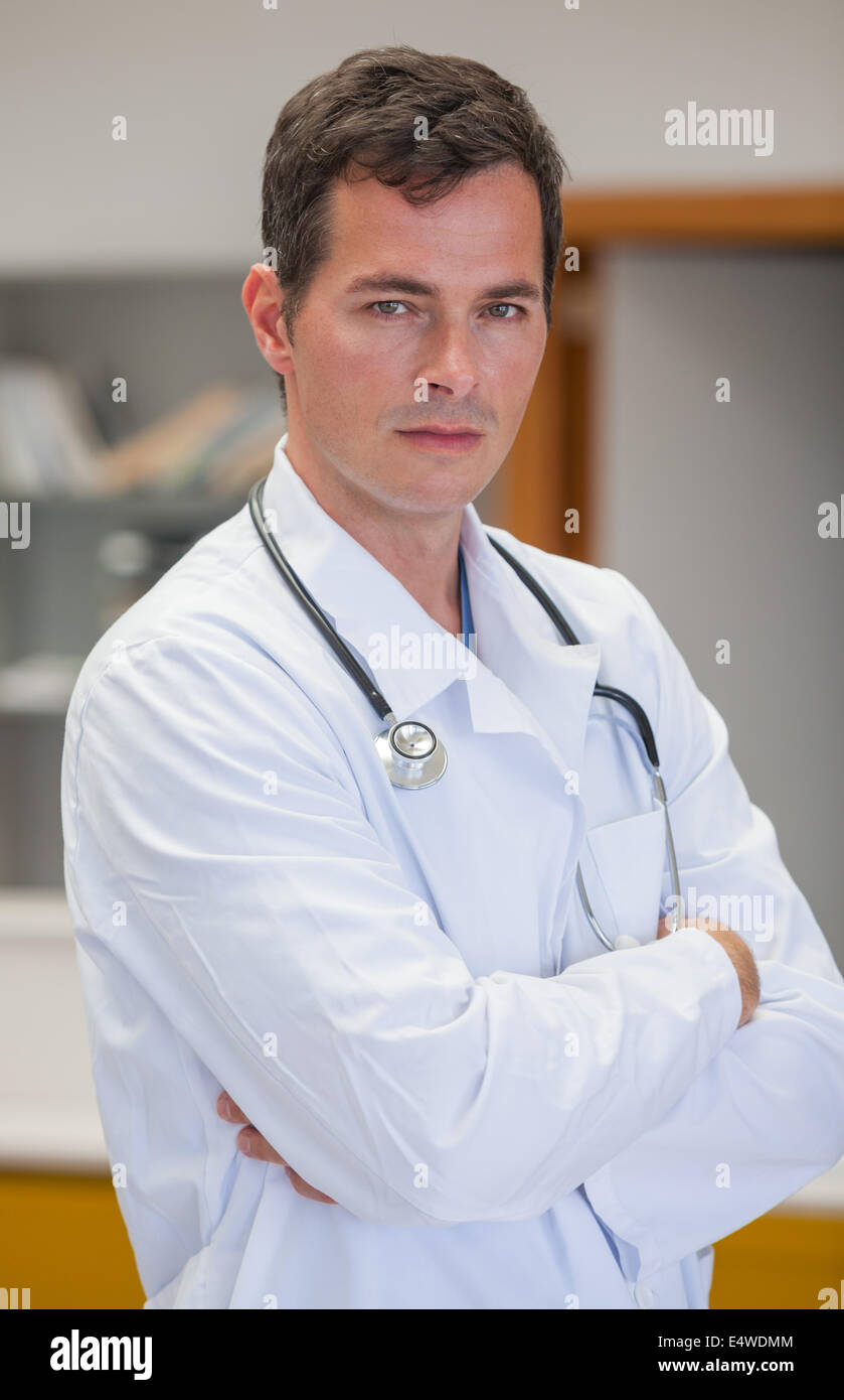 Serious doctor with arms crossed Stock Photo - Alamy
