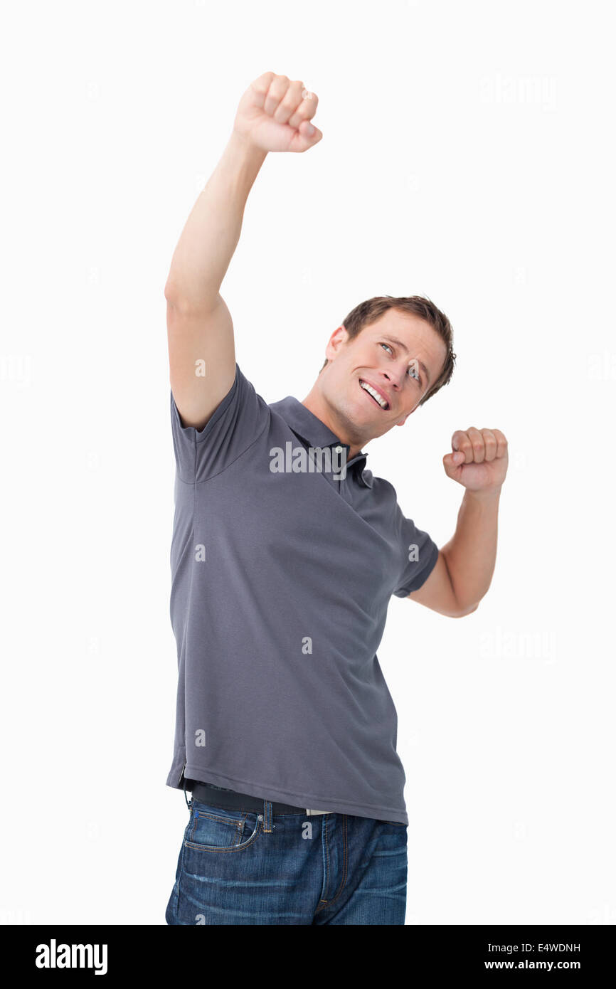 Successful young man celebrating Stock Photo - Alamy