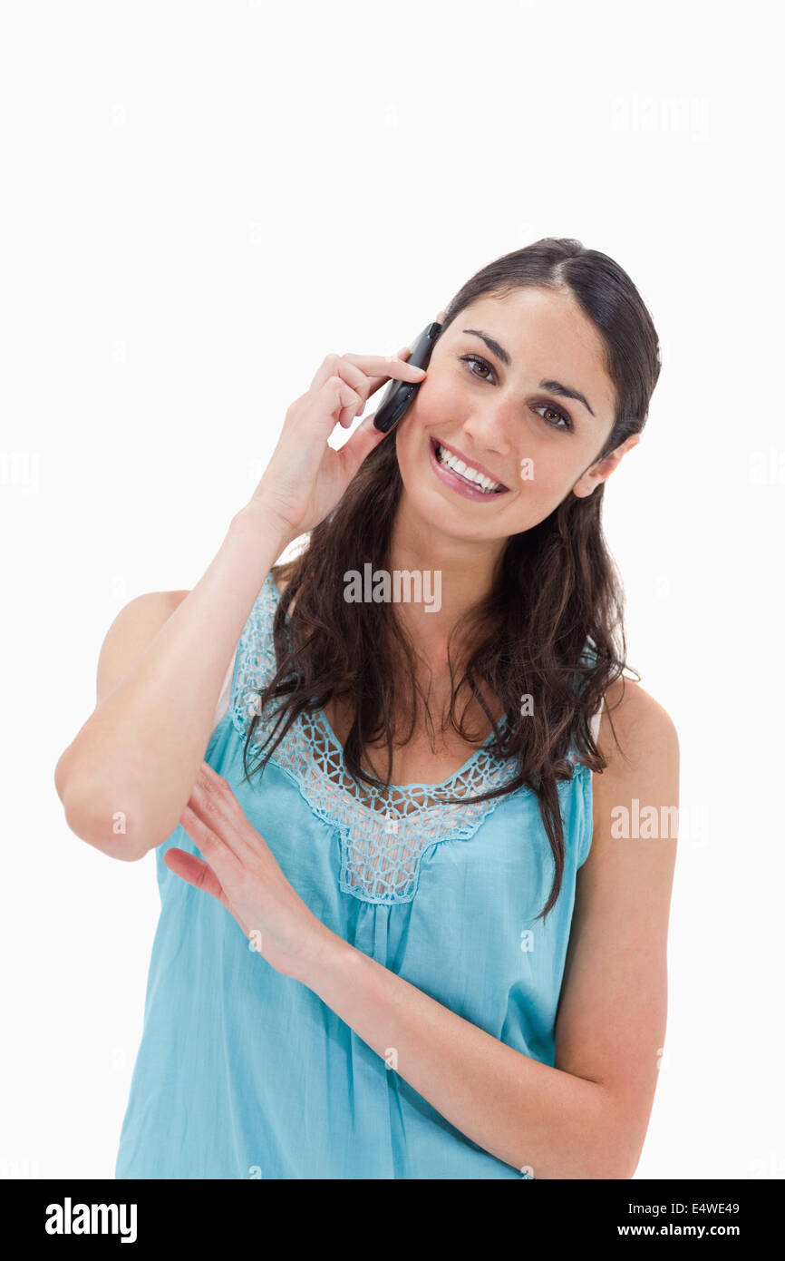 Portrait of a woman making a phone call Stock Photo - Alamy