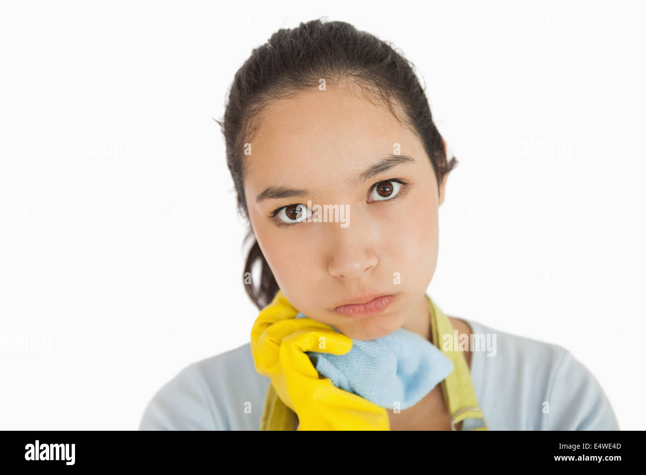 Weary woman holding cleaning rag Stock Photo - Alamy