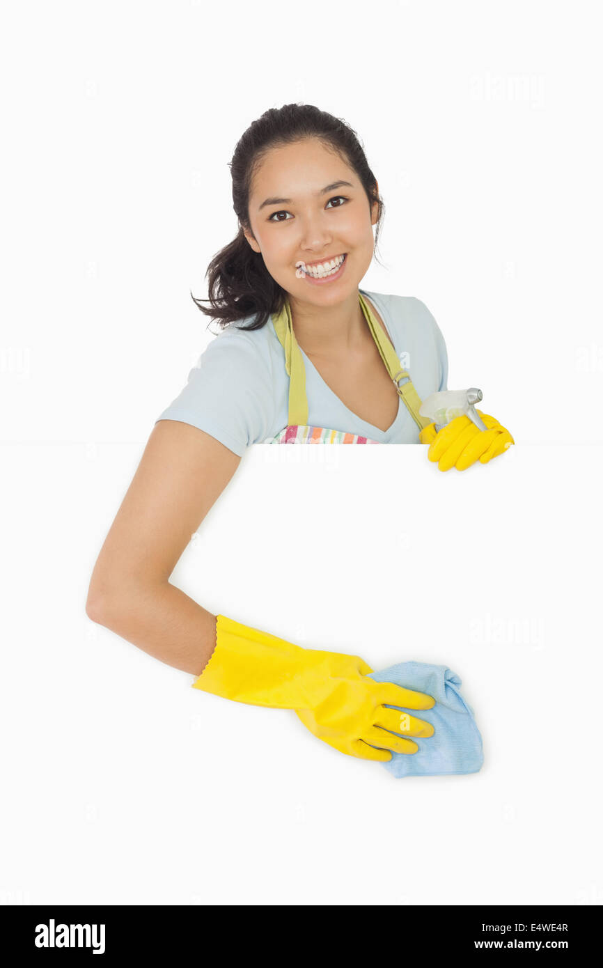 Woman wiping down surface hi-res stock photography and images - Alamy