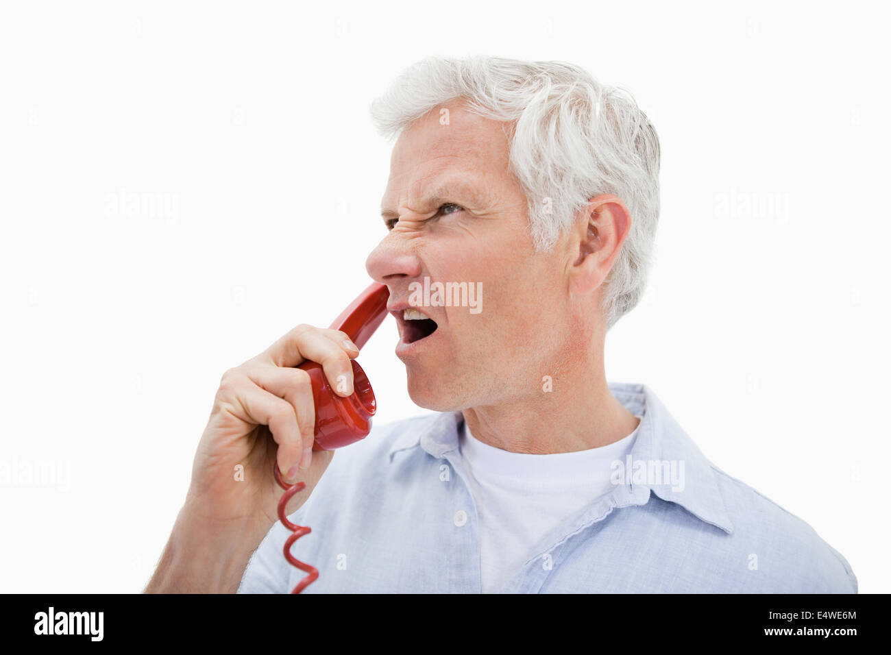 Angry man making a phone call Stock Photo - Alamy