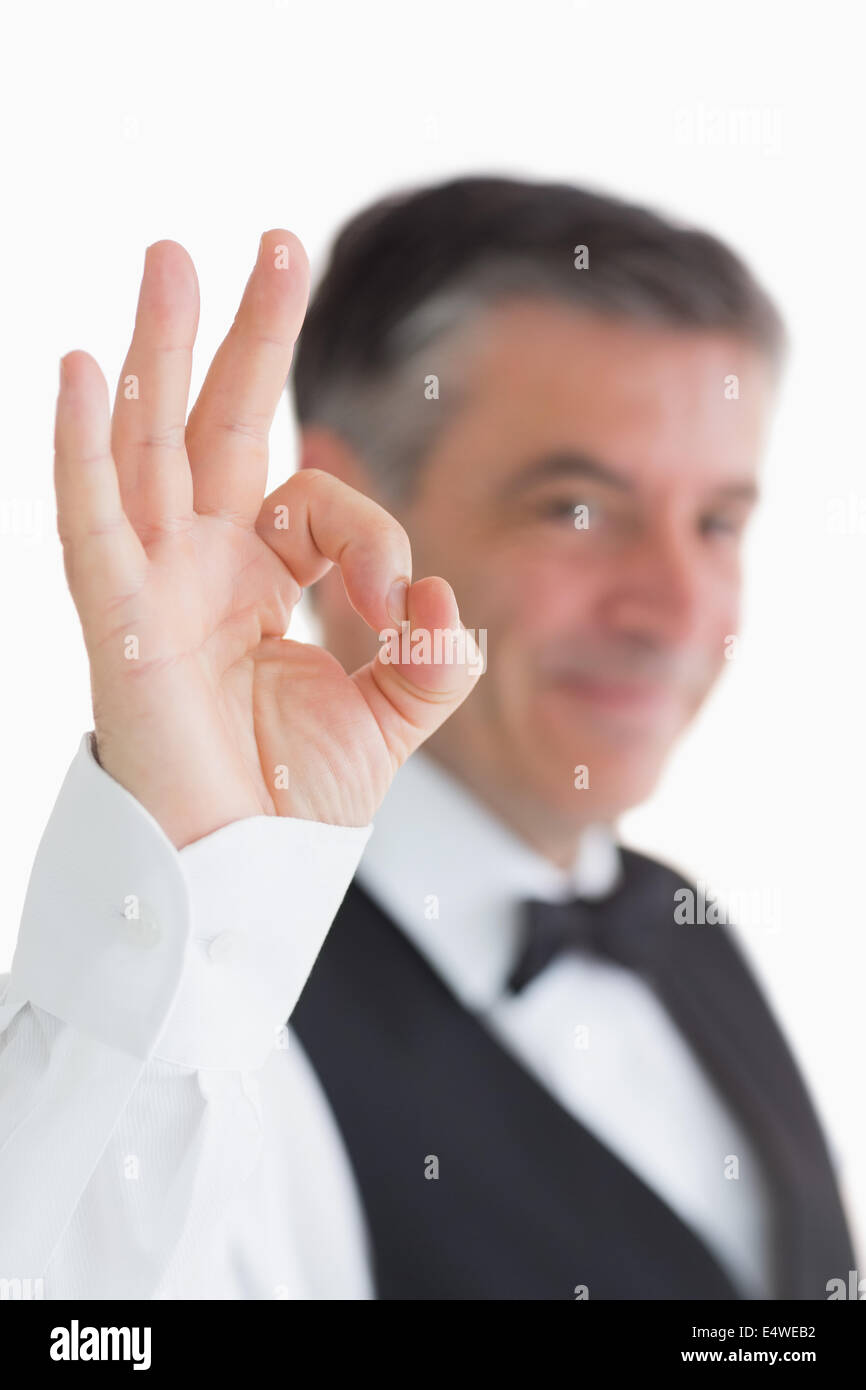 Waiter making ok sign Stock Photo - Alamy