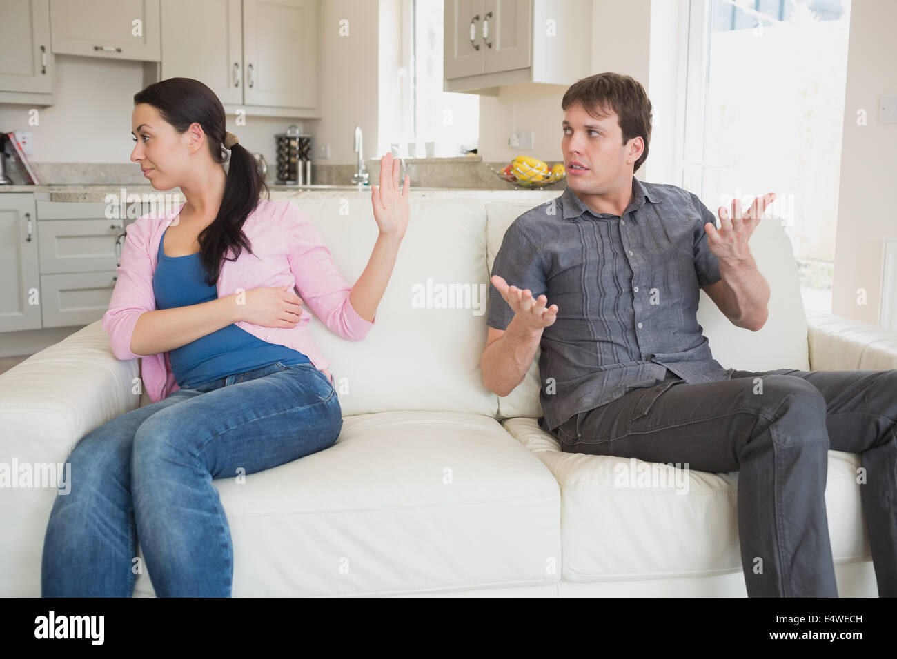 Two young people having a dispute Stock Photo - Alamy