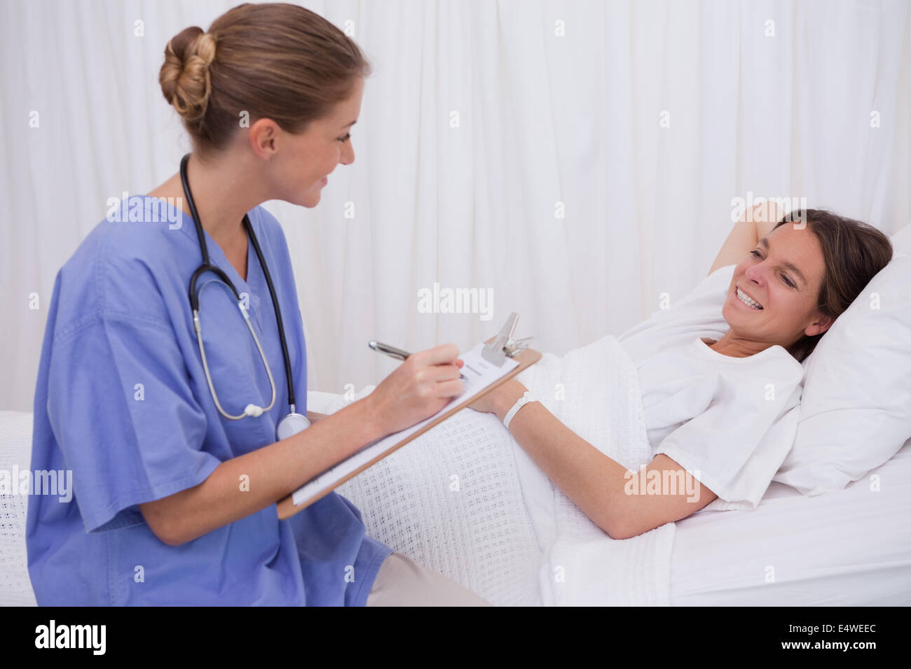 Surgeon talking with patient Stock Photo - Alamy