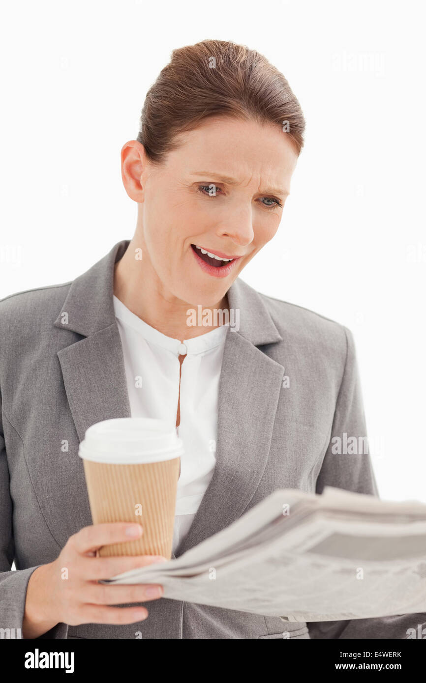 surprised businesswoman reading newspaper Stock Photo - Alamy