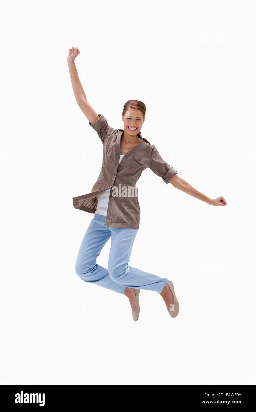Excited woman jumping celebrating success hi-res stock photography and ...