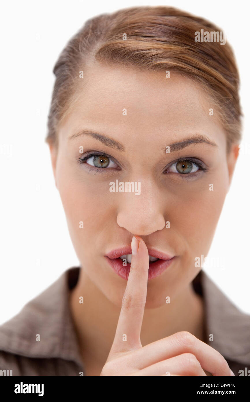 Young woman asking for silence Stock Photo - Alamy