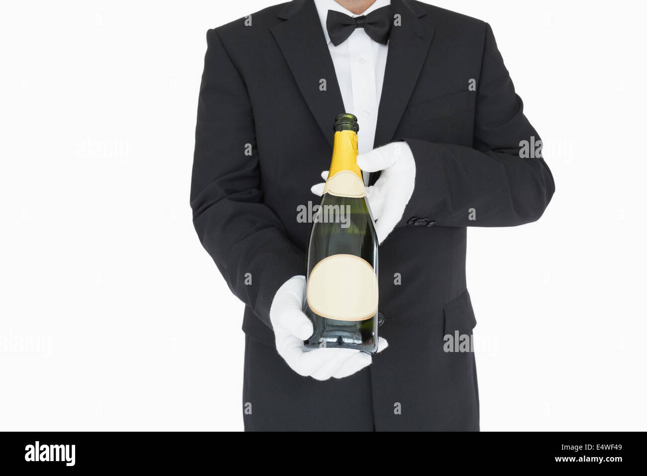 Waiter holding champagne bottle Stock Photo - Alamy