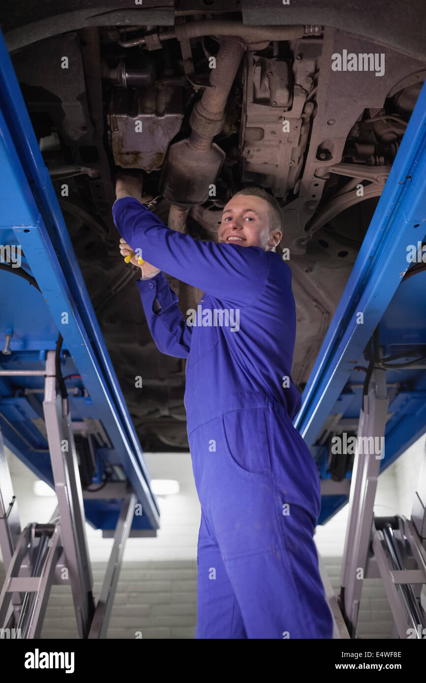 Man repairing a car Stock Photo - Alamy