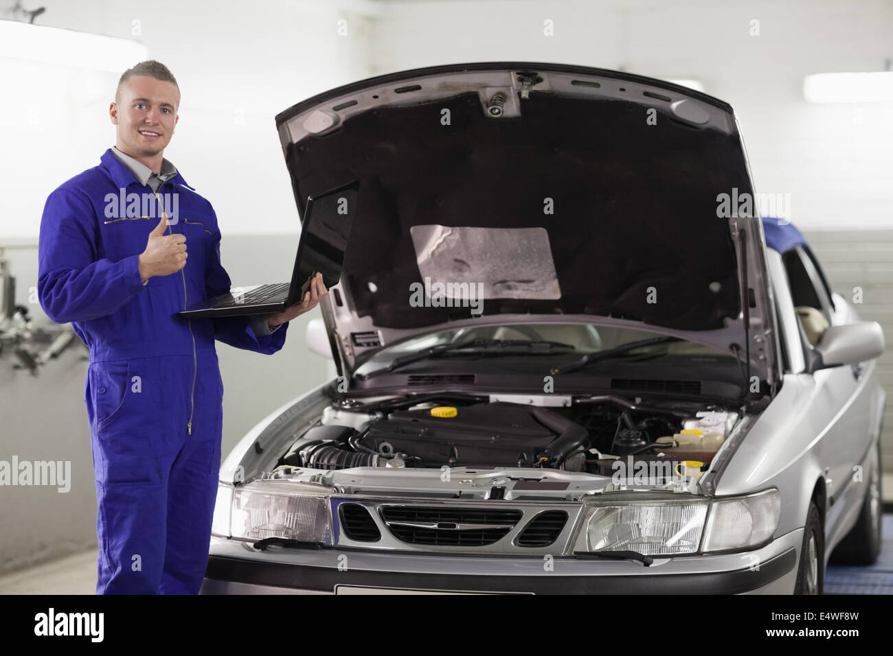 Happy computer engineer thumb up hi-res stock photography and images ...
