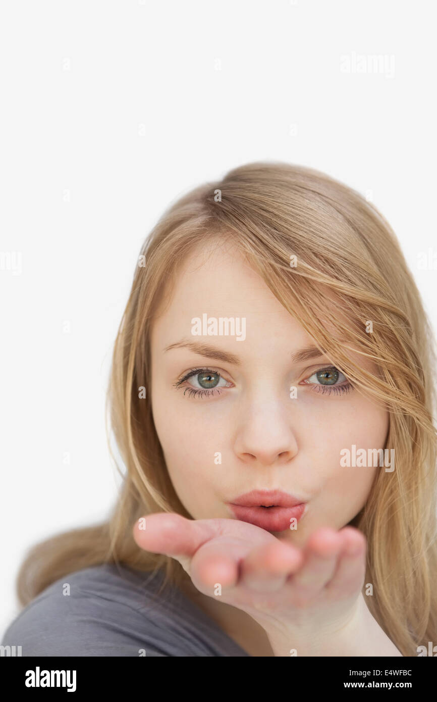 Woman blowing on her hand Stock Photo - Alamy