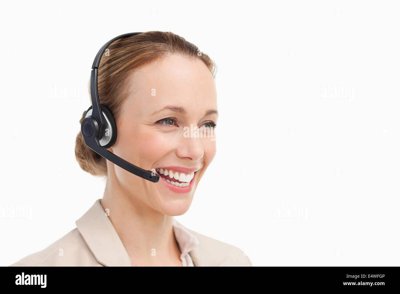 Woman in a suit with headset speaking Stock Photo - Alamy