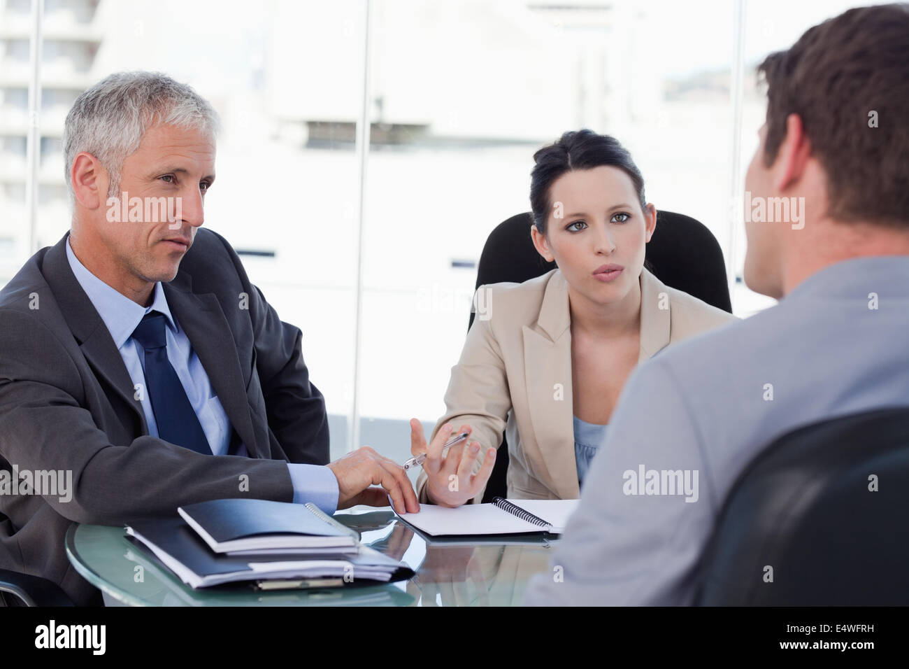 Business team negotiating with a customer Stock Photo - Alamy