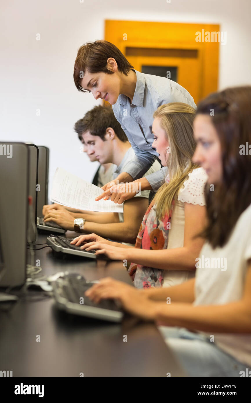 Teacher explaining to the student Stock Photo - Alamy
