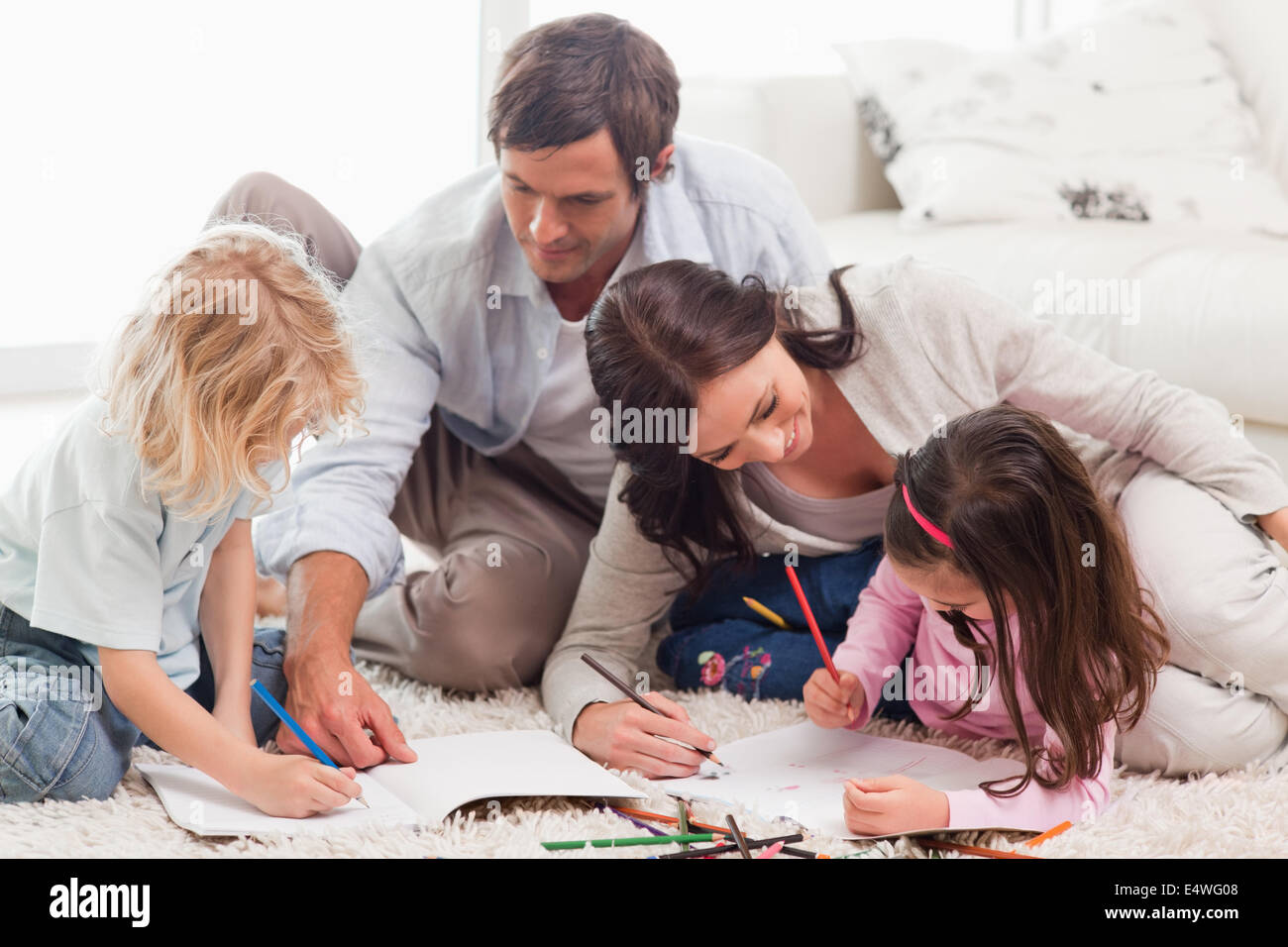 Beautiful family drawing together Stock Photo - Alamy