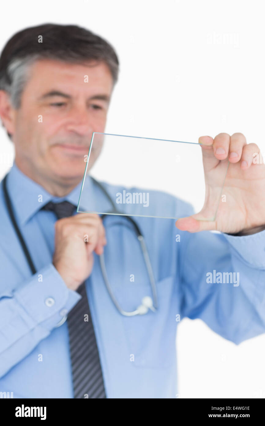 Smiling doctor viewing glass slide Stock Photo - Alamy