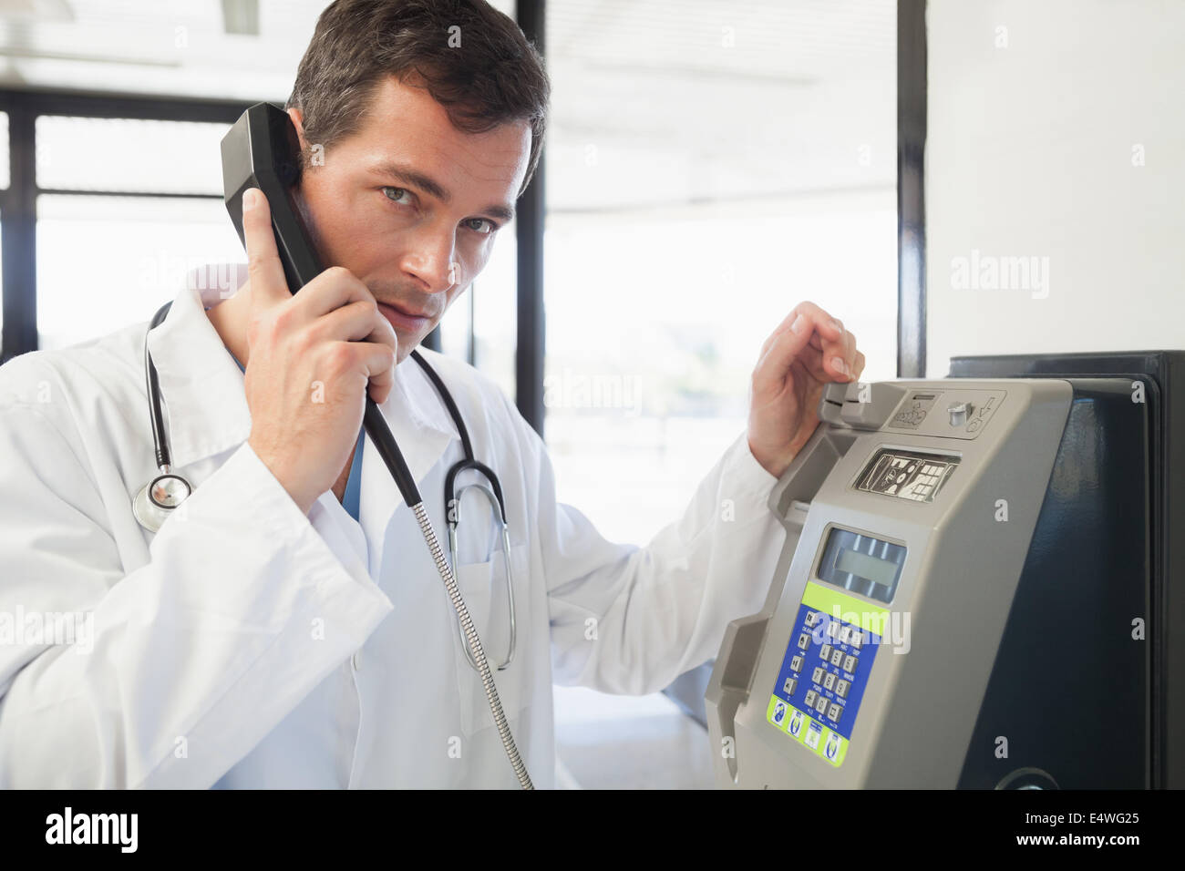 Doctor phoning in the hospital Stock Photo - Alamy