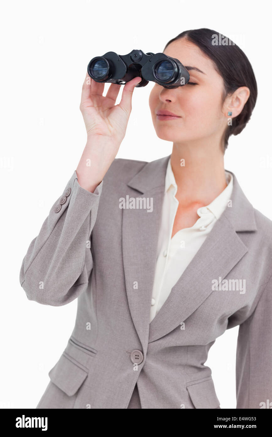 Businesswoman looking through spy glasses Stock Photo - Alamy