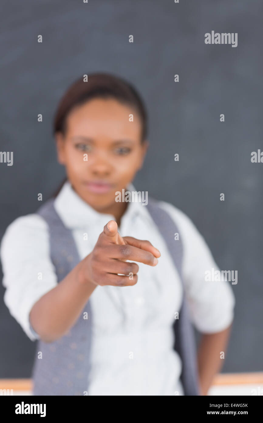 Teacher pointing on blackboard hi-res stock photography and images - Alamy