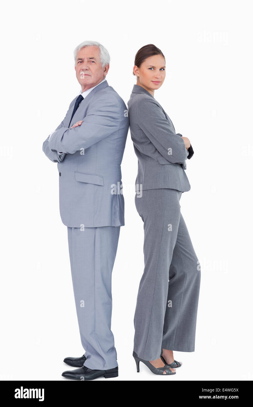 Businessteam standing back to back Stock Photo - Alamy