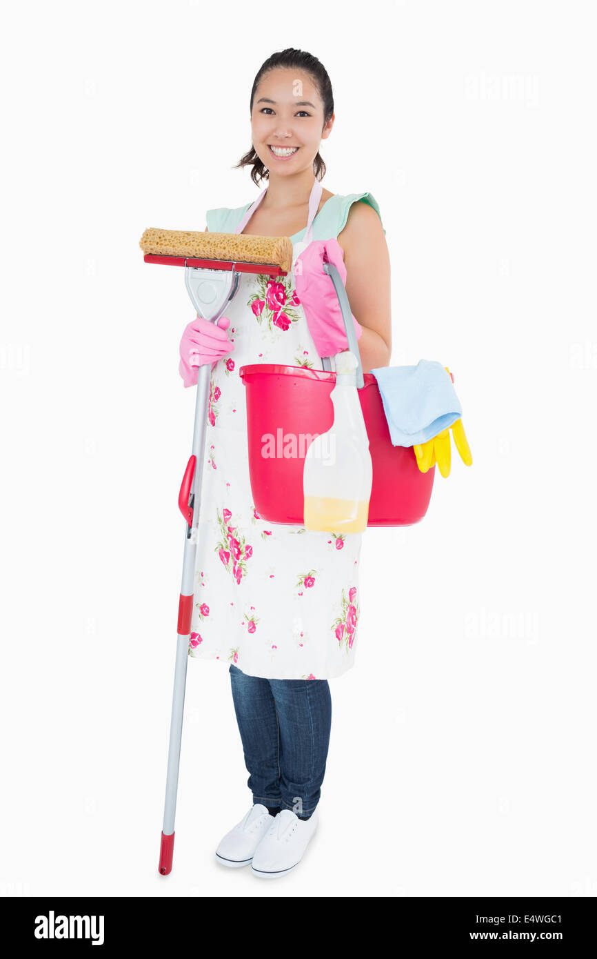 Woman holding some cleaning tools Stock Photo - Alamy