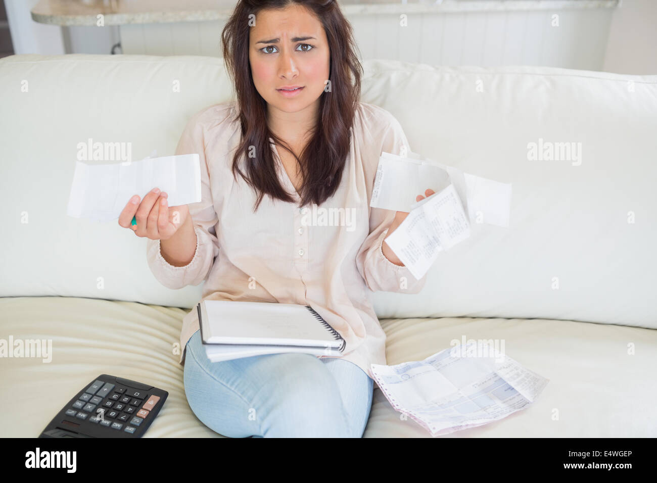 Woman getting stressed over bills Stock Photo - Alamy
