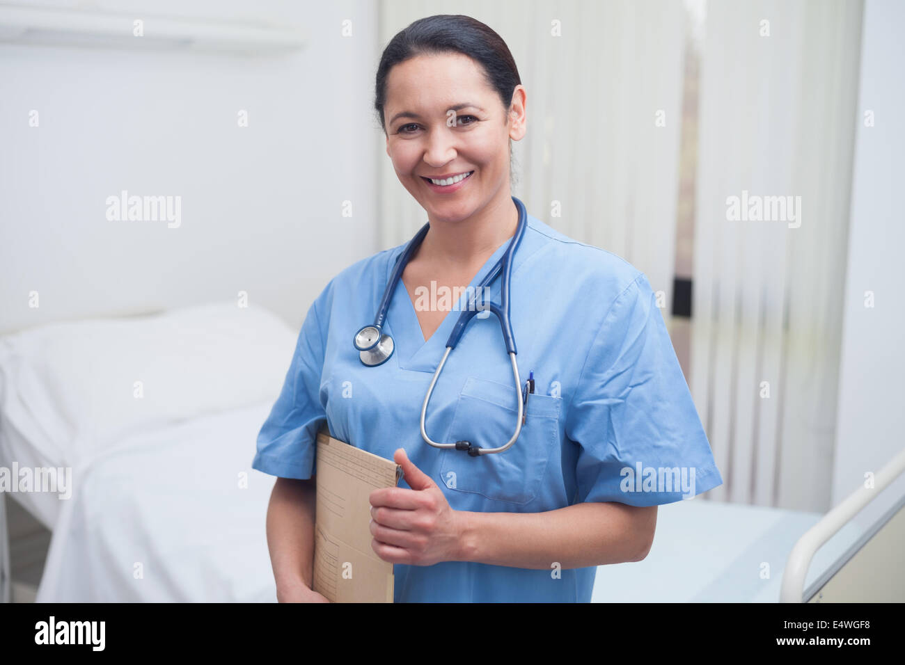 Nurse holding a medical folder Stock Photo - Alamy