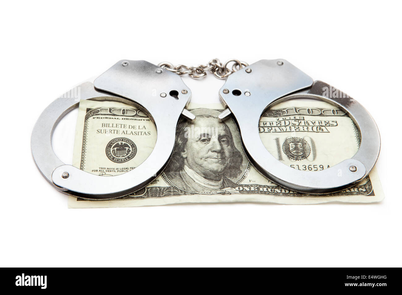 Handcuffs and money Stock Photo - Alamy