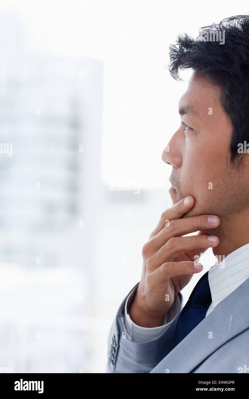 Portrait of an office worker thinking Stock Photo - Alamy