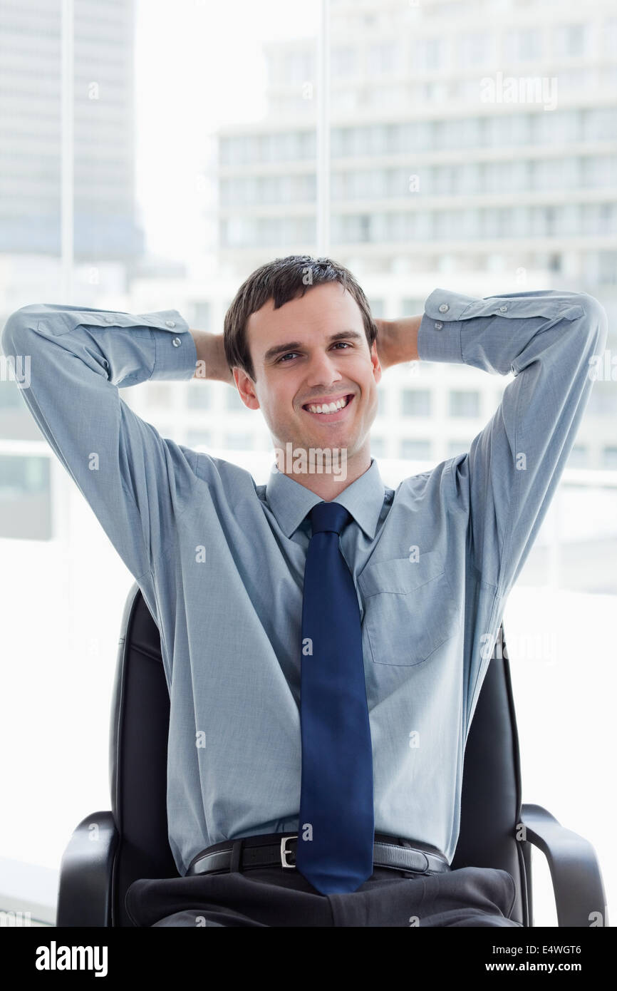 Portrait of a happy manager relaxing Stock Photo - Alamy