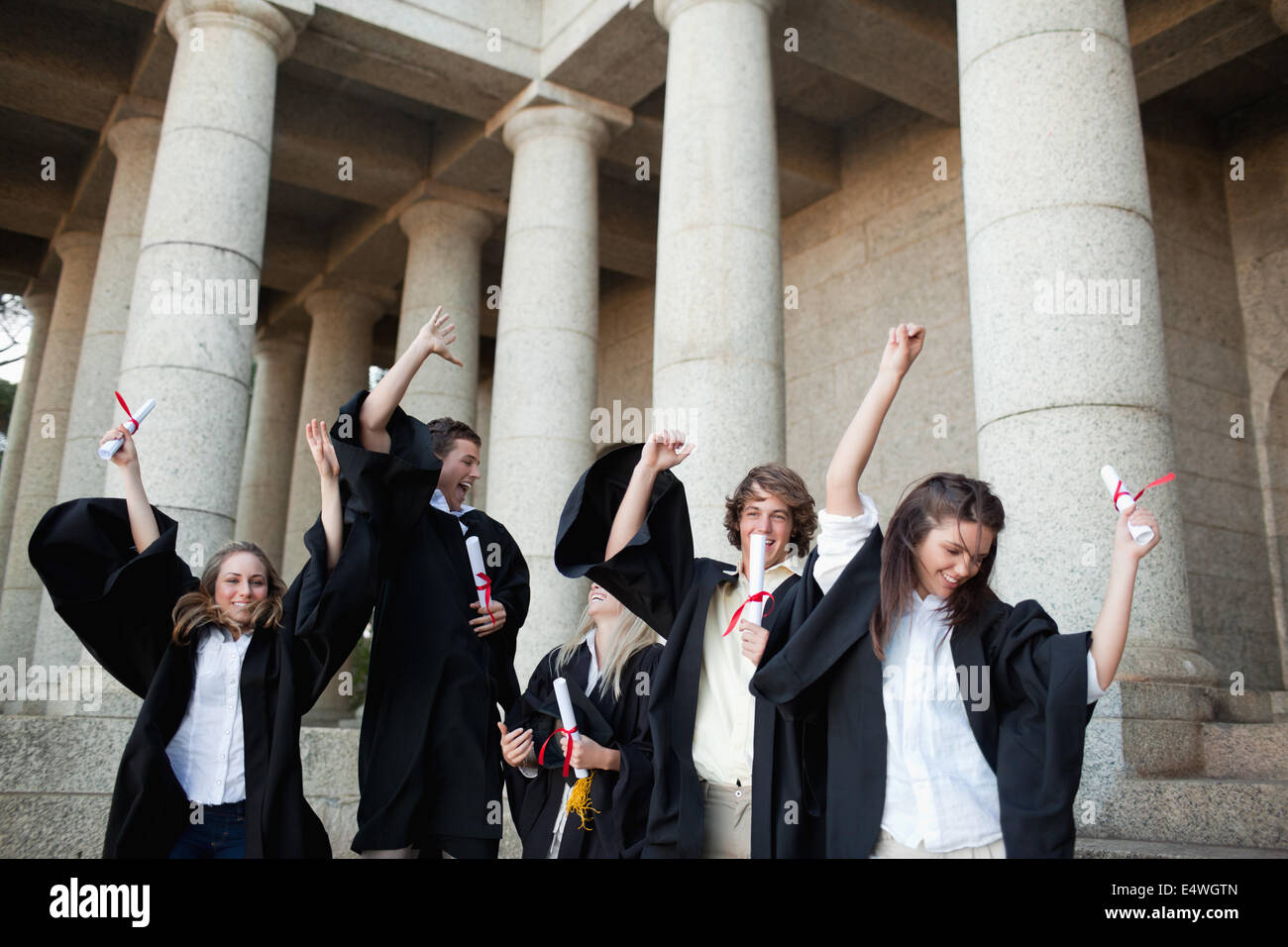 Graduates dancing in togas Stock Photo - Alamy