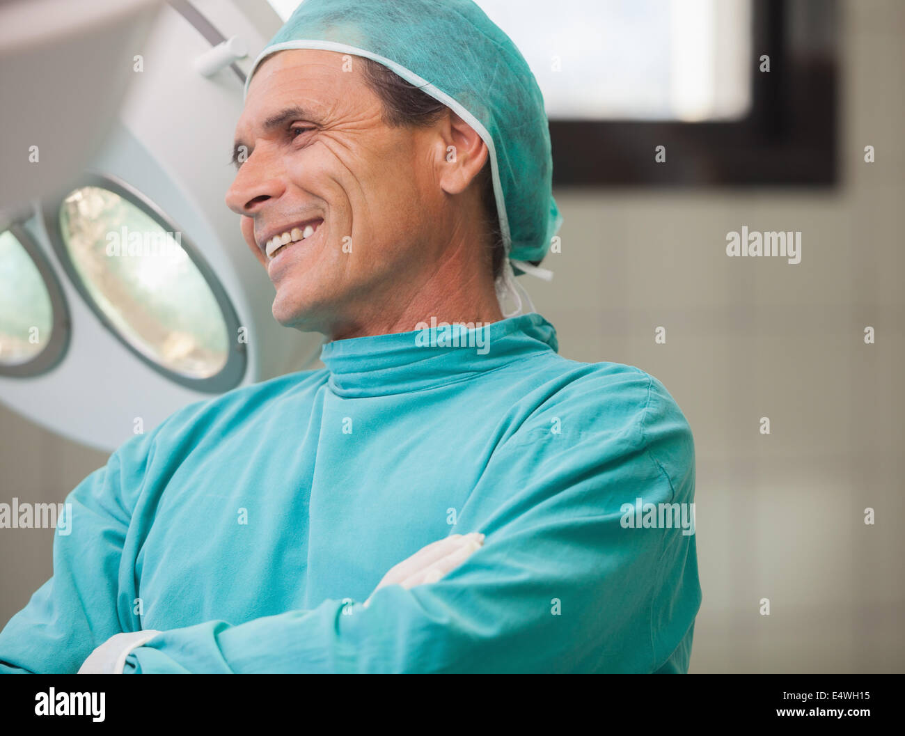 Surgeon smiling with arms crossed Stock Photo - Alamy