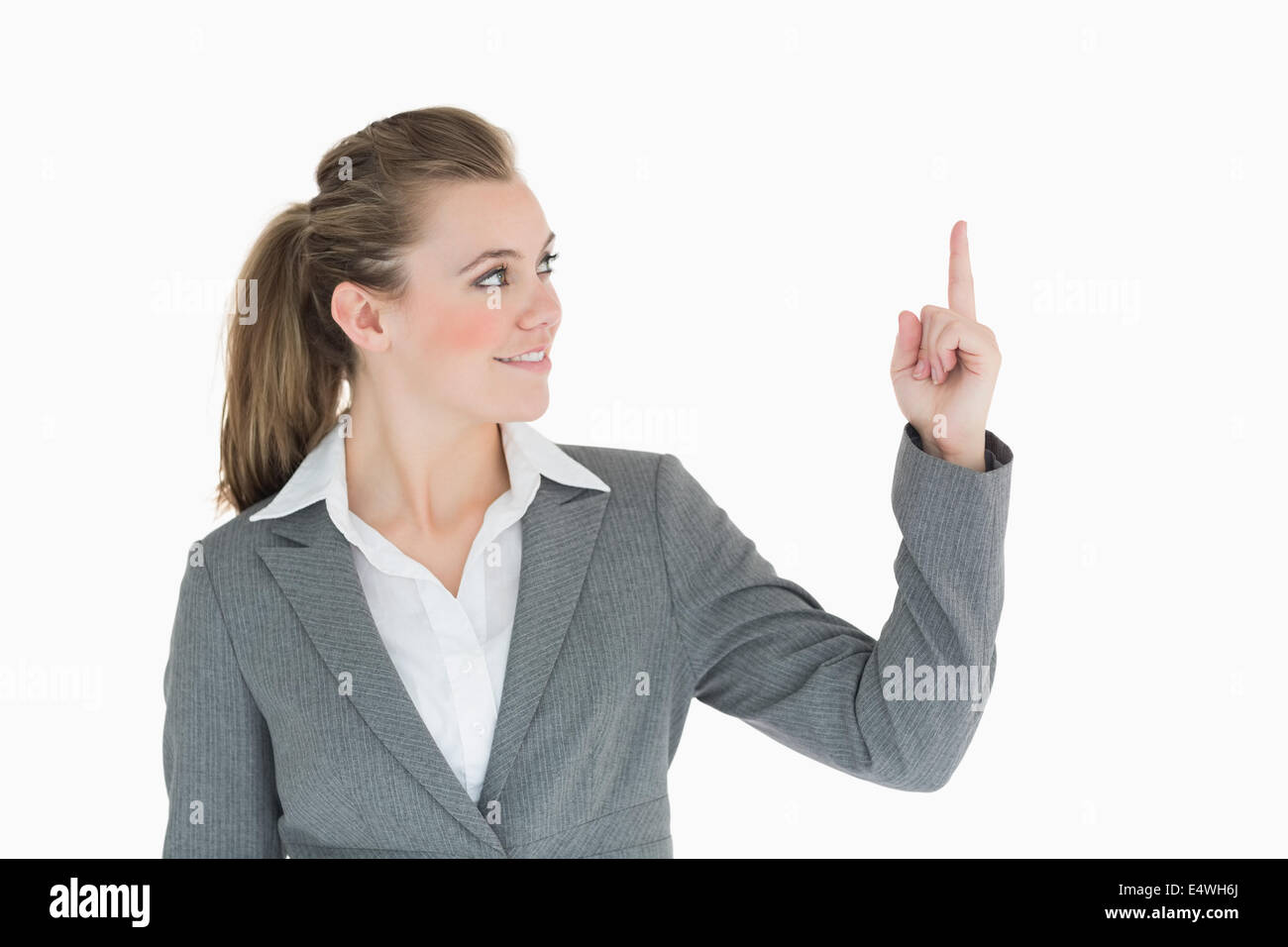 Businesswoman pointing up Stock Photo - Alamy