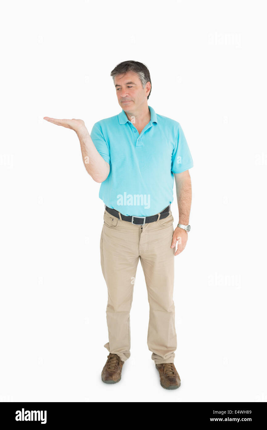 Man looking at his hand Stock Photo - Alamy