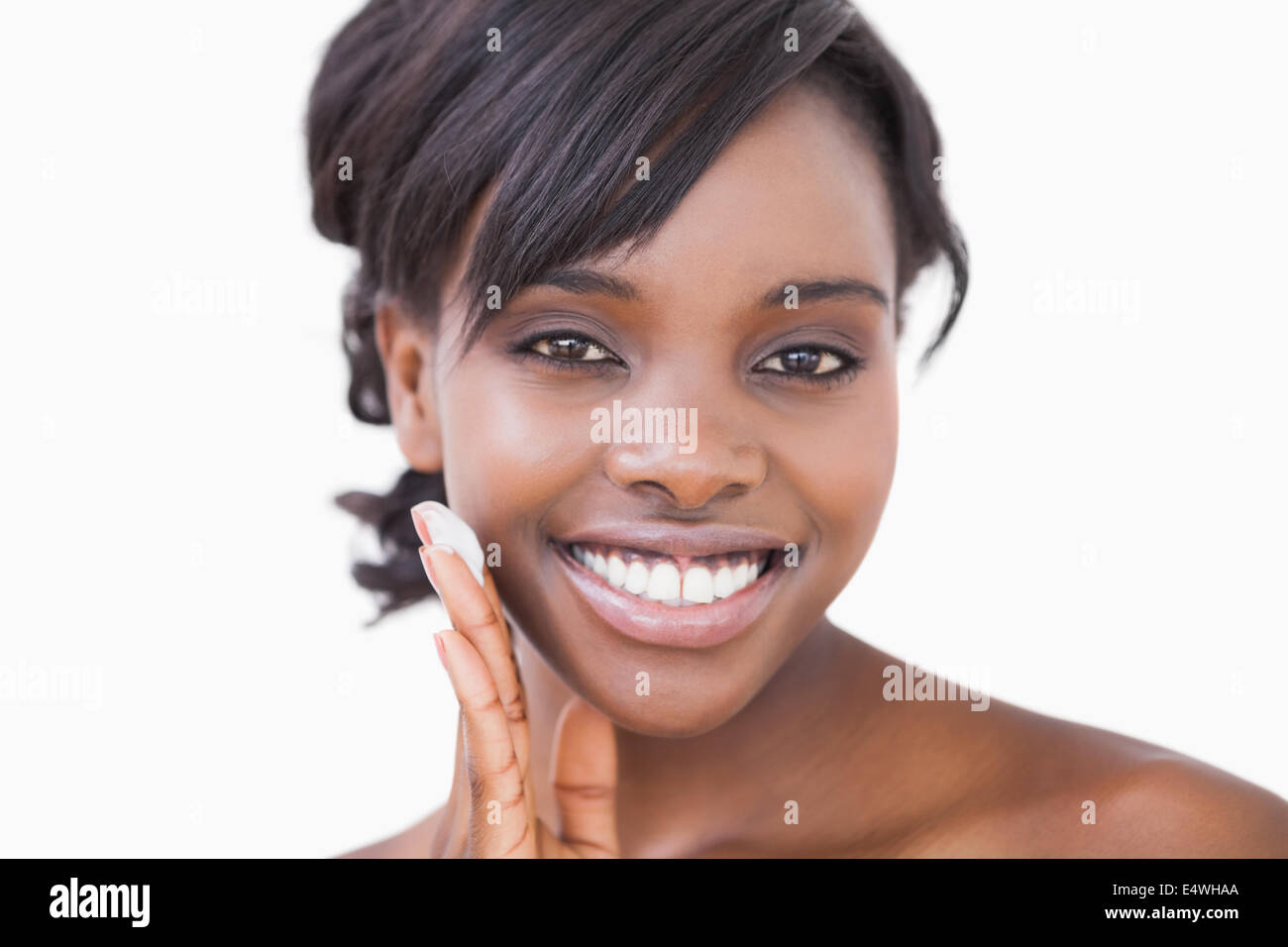 Woman applying face cream Stock Photo - Alamy