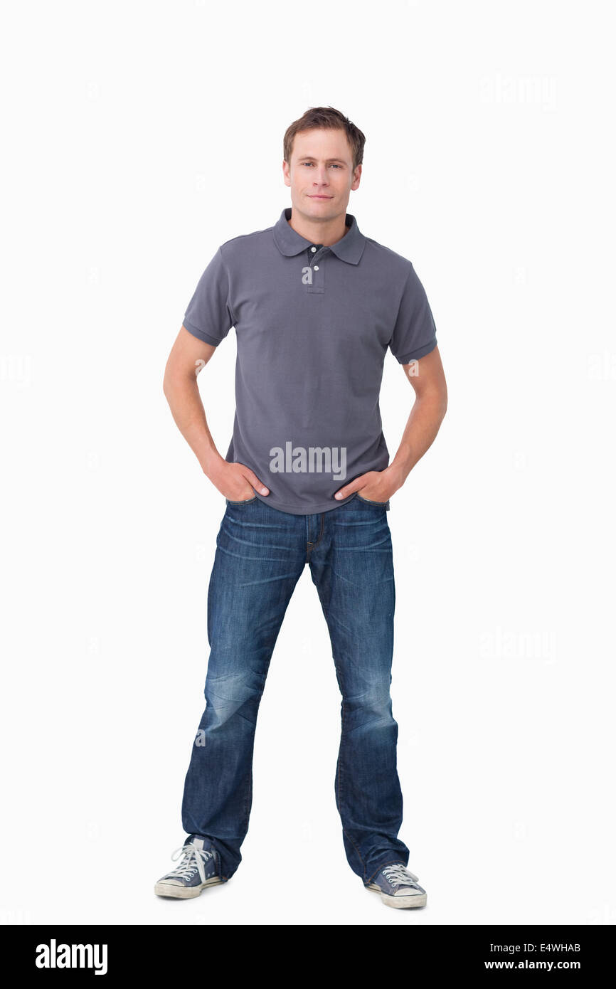 Young man with hands in his pockets Stock Photo - Alamy