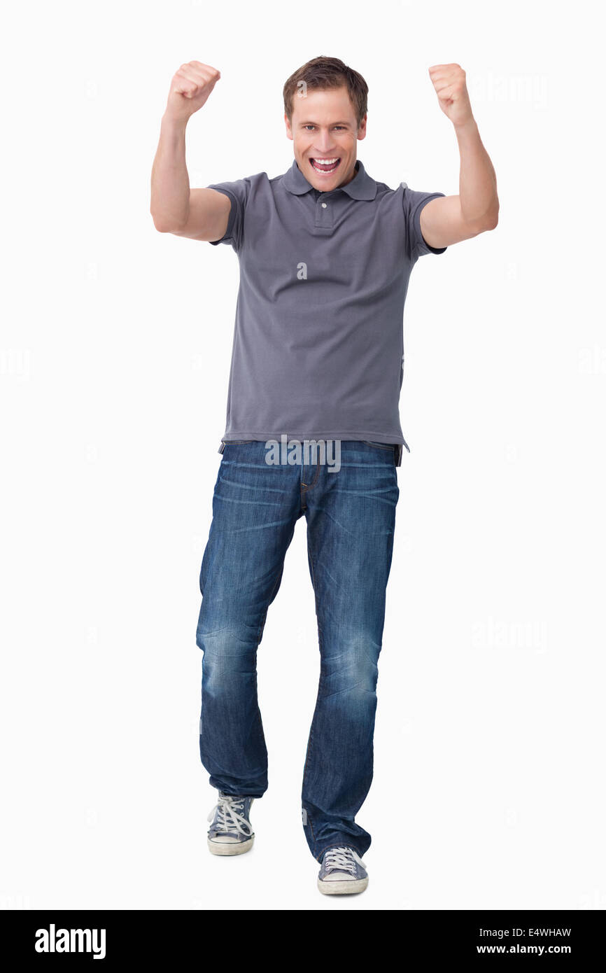 Cheering young man Stock Photo - Alamy Cheering young man Stock Photo - Alamy