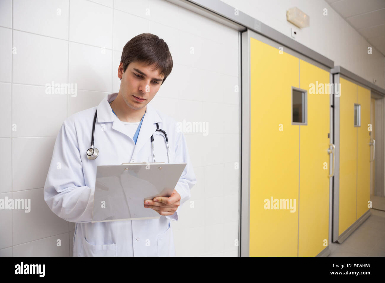 Doctor making notes Stock Photo - Alamy